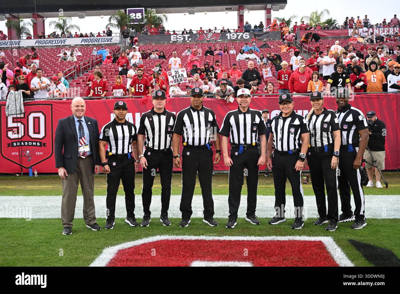 The officiating crew, from left to right, back judge Tyree Walton, side ...