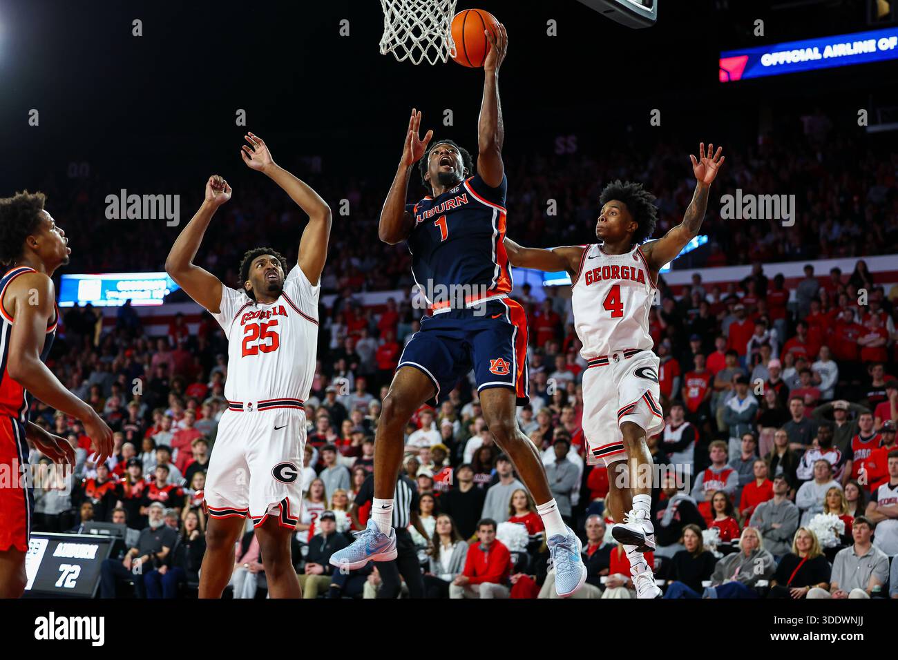 Auburn guard Kevin Overton (1) shoots against Georgia forward Justin ...