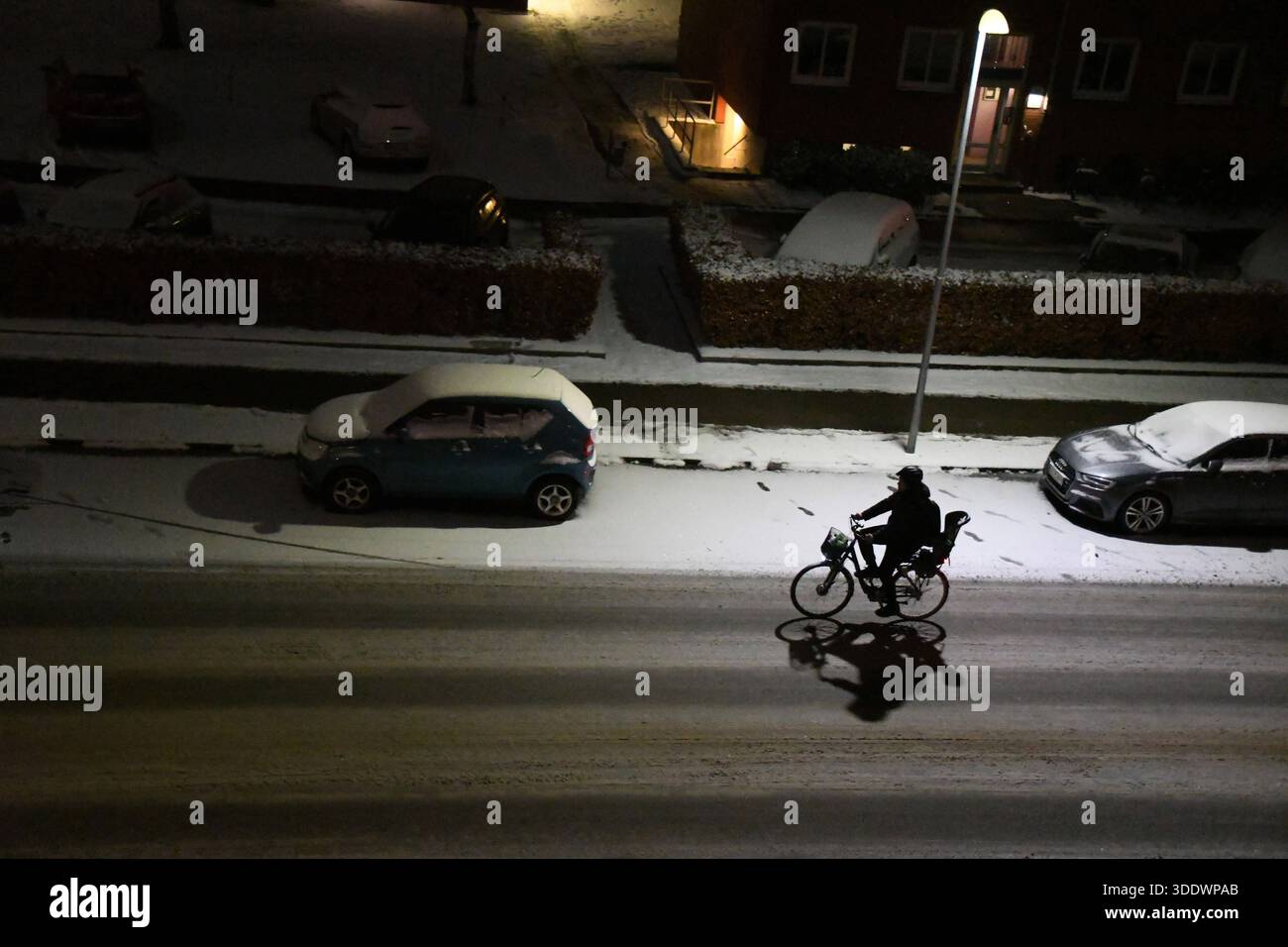kASTRUP/Copenhagen/ Denmark/03 JAN 2026/Biker in snow fall weather on ...