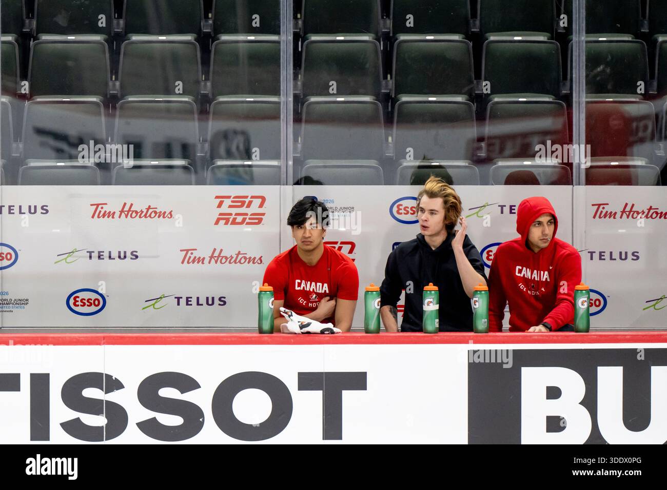 Canada's Zayne Parekh (19), Gavin McKenna (9), Michael Hage (29) watch ...