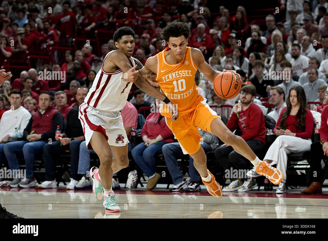 Tennessee forward Nate Ament (10) tries to drive past Arkansas guard ...