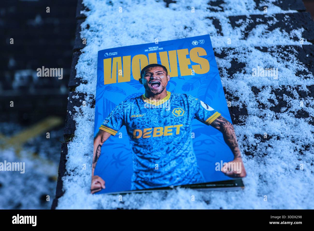 Programme in the snow outside the stadium during the Premier League ...