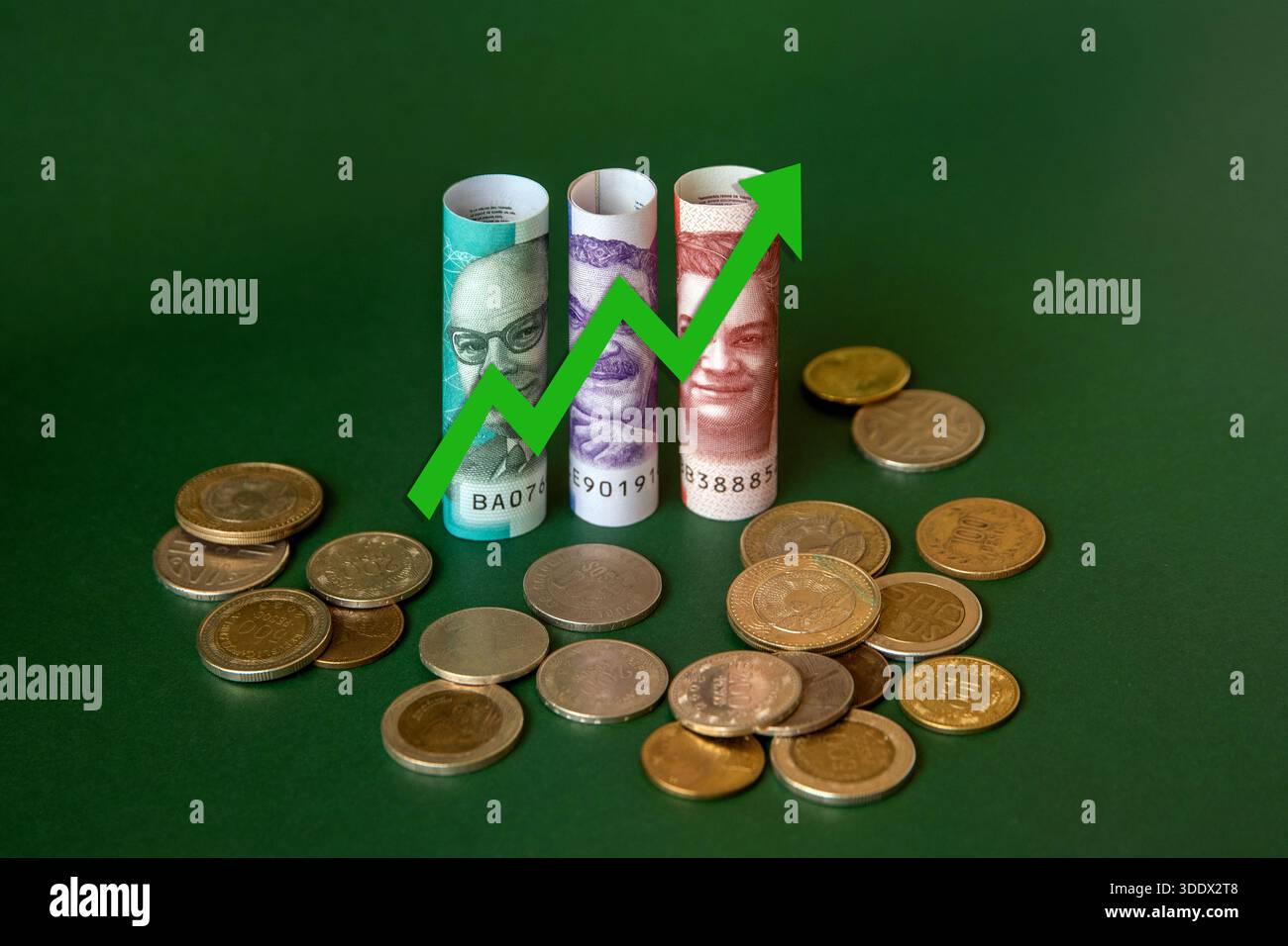 Concept of minimum wage increase using Colombian peso bills and coins ...