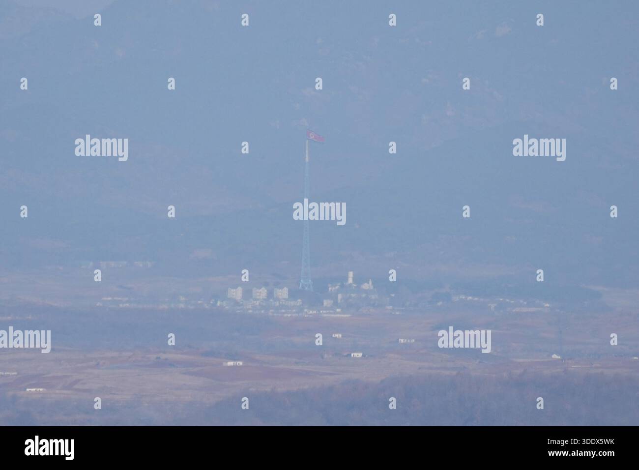 A North Korean flag flutters in the wind atop a 160-meter (525-foot ...