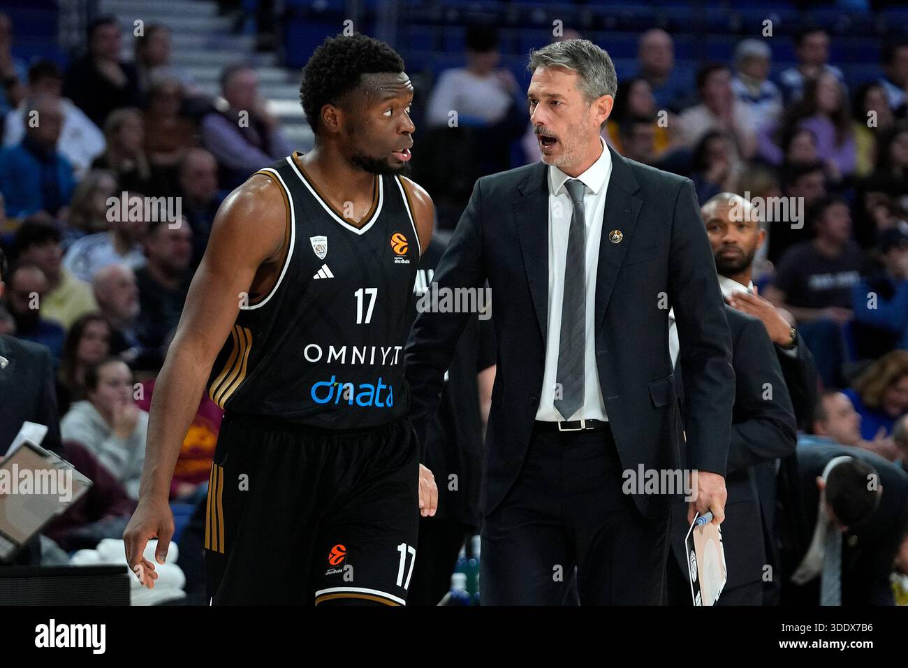 Dubai Basketball's coach Jurica Goleman with his player Mfiondu ...