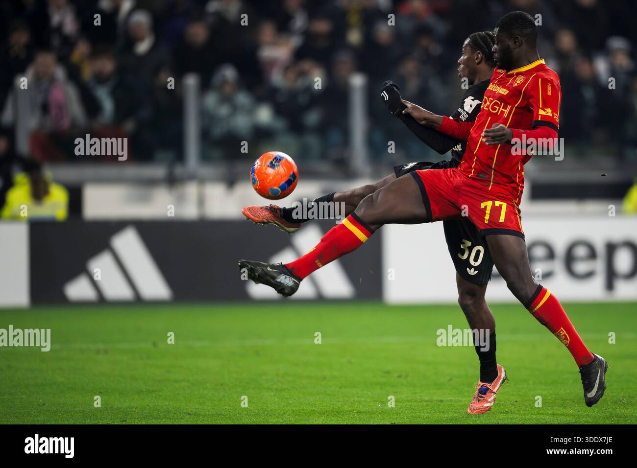 Jonathan David of Juventus FC competes for the ball with Mohamed Kaba ...