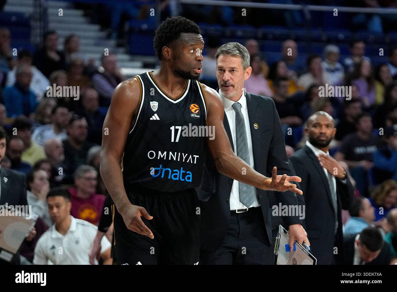 Dubai Basketball's coach Jurica Goleman with his player Mfiondu ...