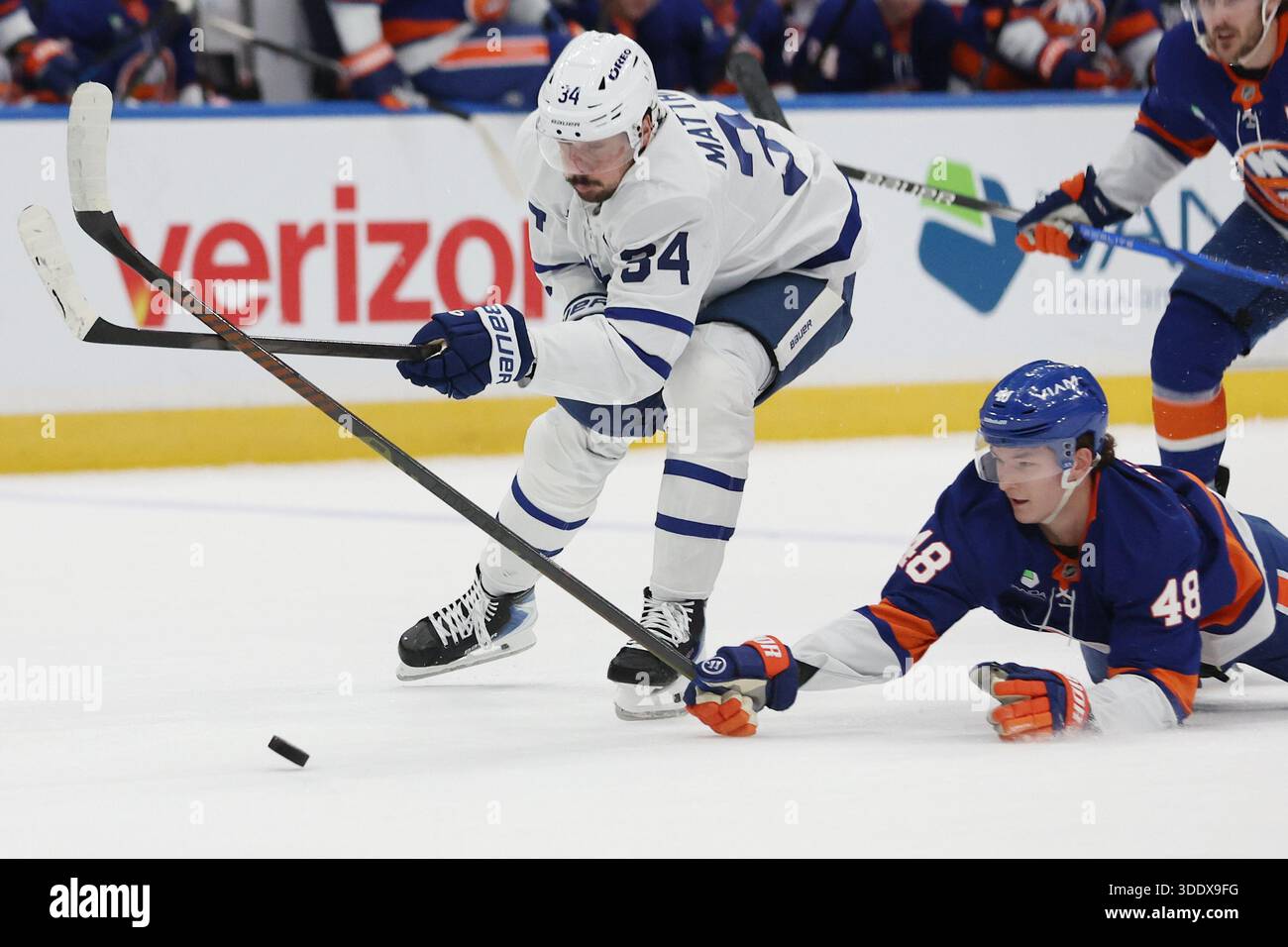 New York Islanders' Matthew Schaefer (48) reaches for the puck against ...