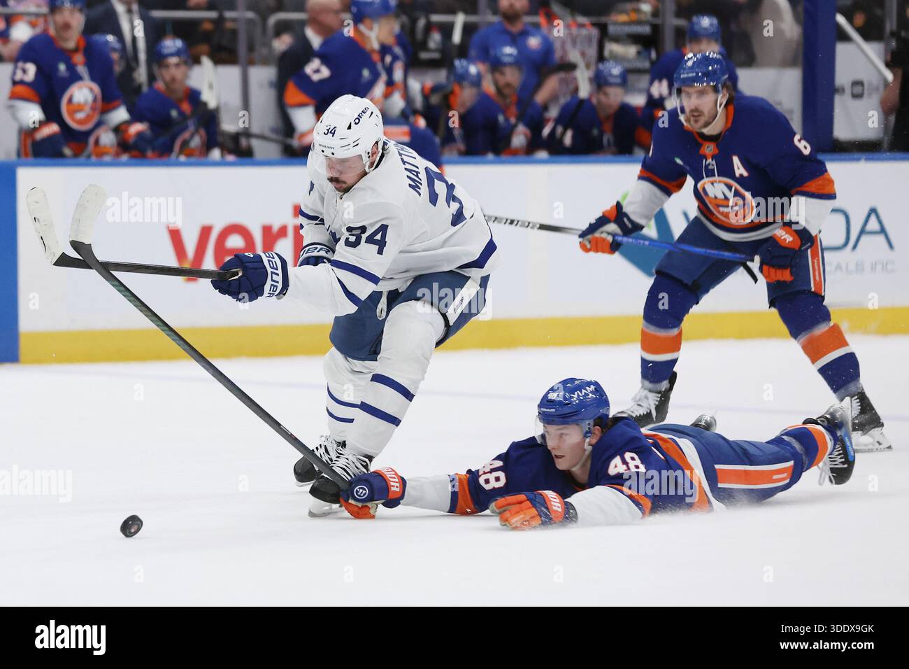 New York Islanders' Matthew Schaefer (48) reaches for the puck against ...
