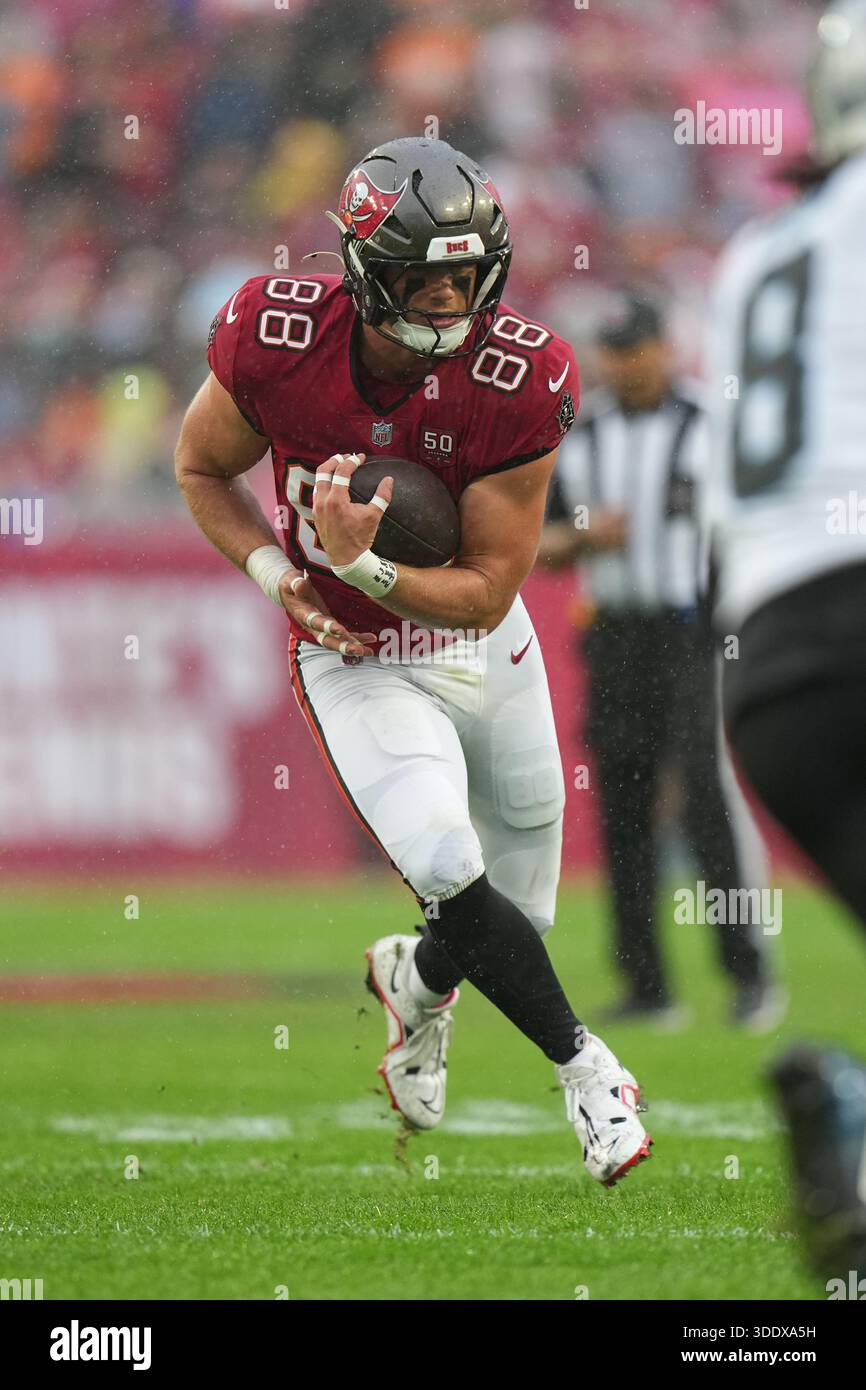 Tampa Bay Buccaneers tight end Cade Otton (88) runs after a catch in ...