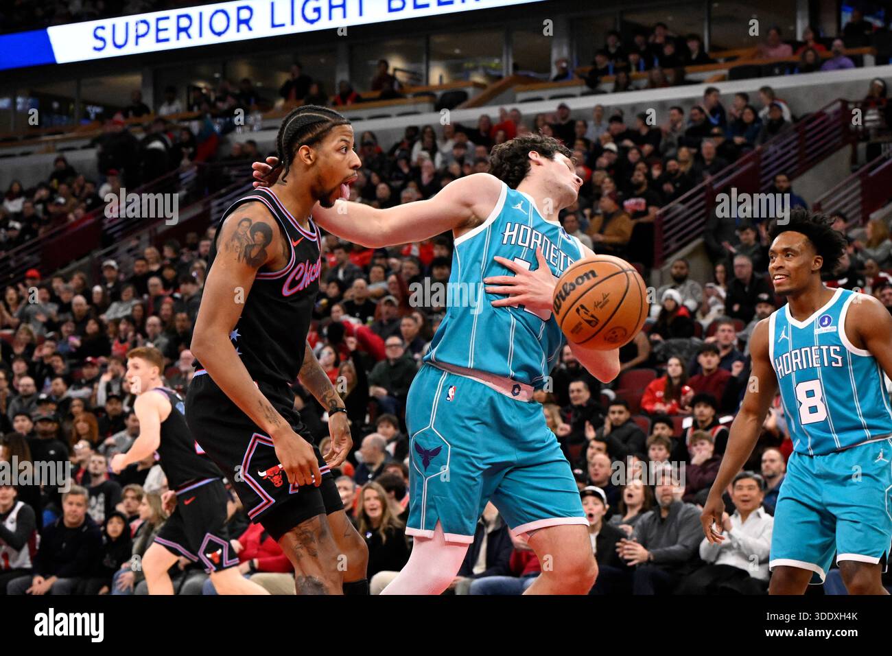 Chicago Bulls forward Dalen Terry, left, sticks his tongue out after ...
