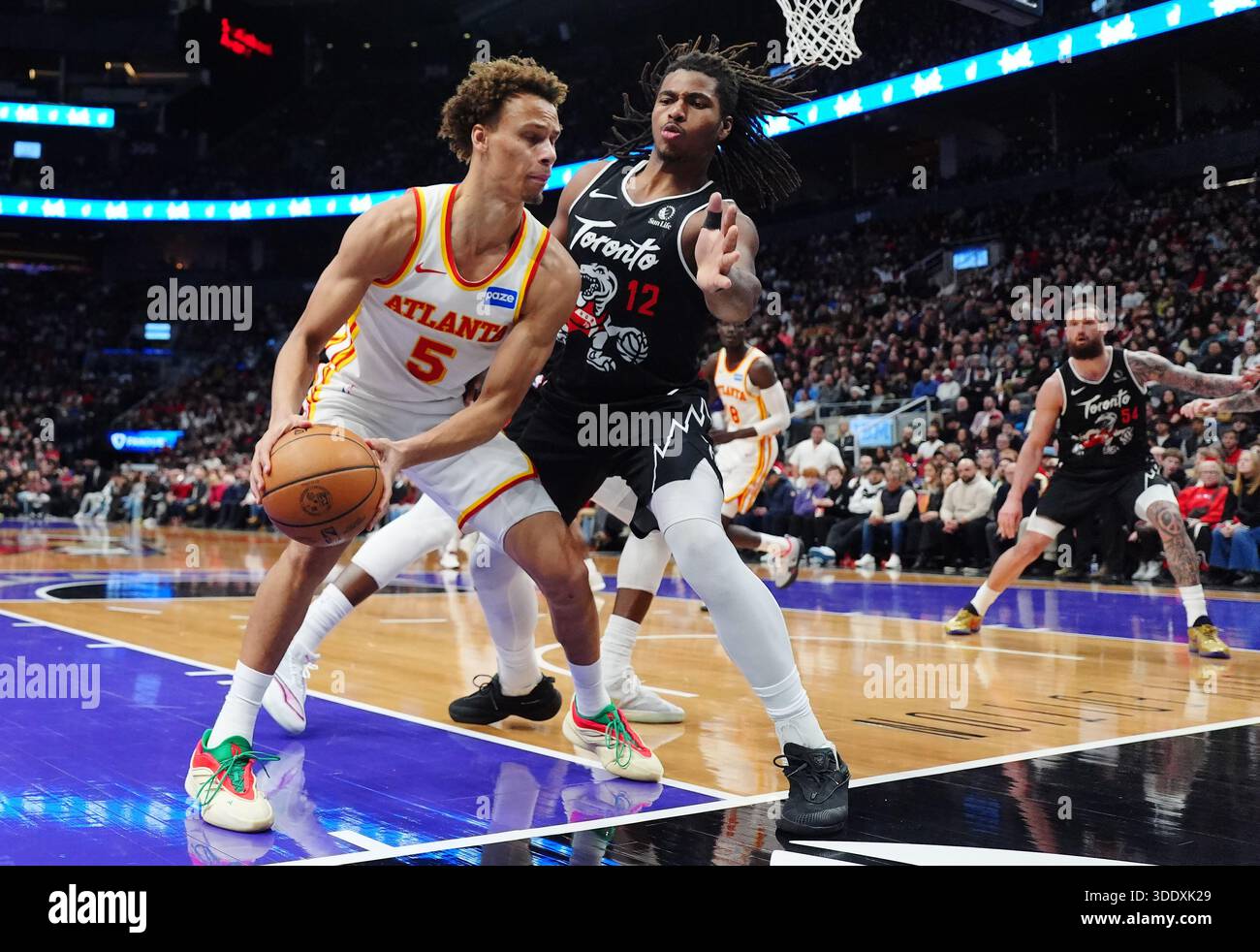 Atlanta Hawks' Dyson Daniels (5) protects the ball from Toronto Raptors ...
