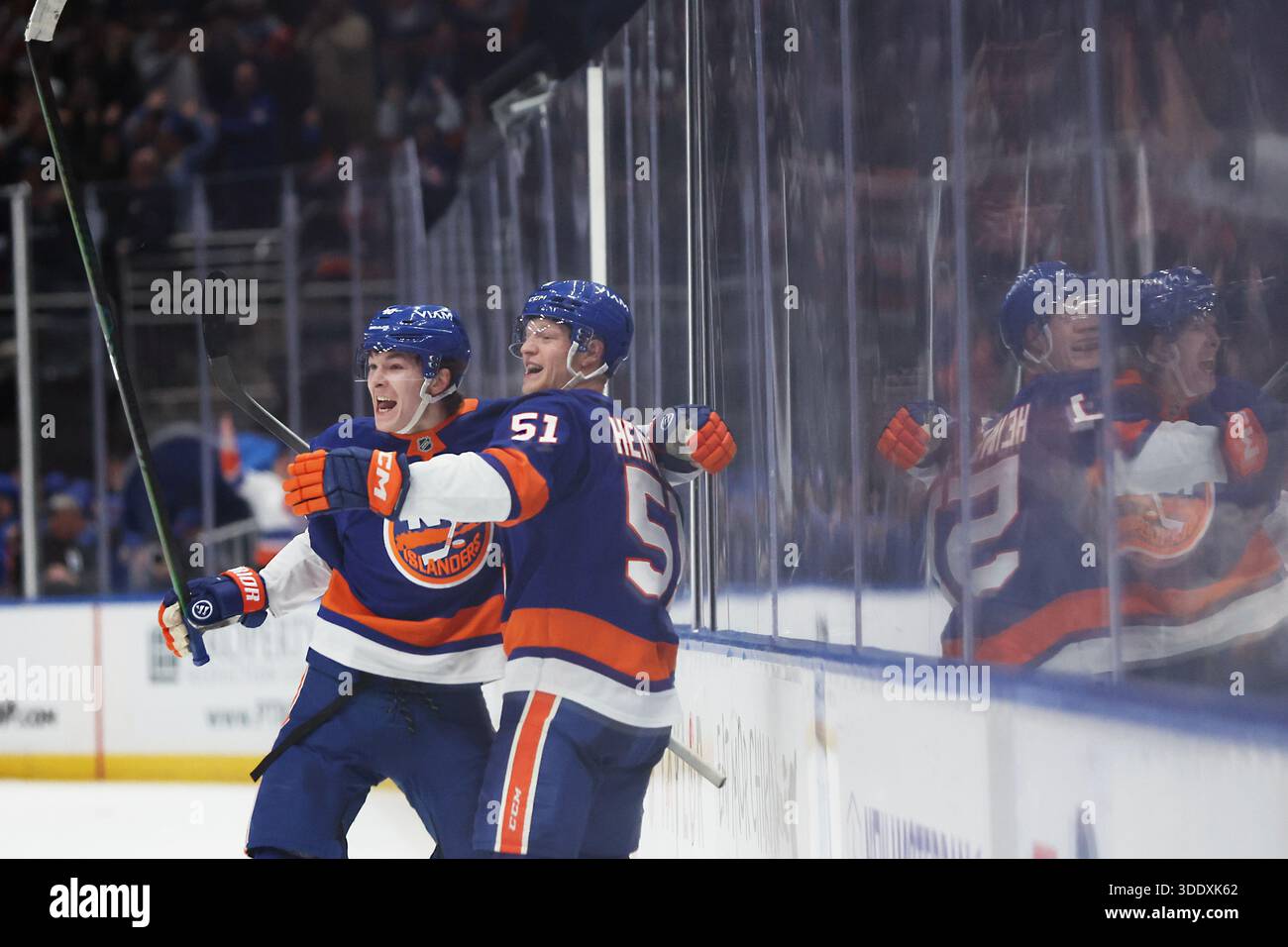 New York Islanders' Matthew Schaefer, left, and teammate Emil Heineman ...