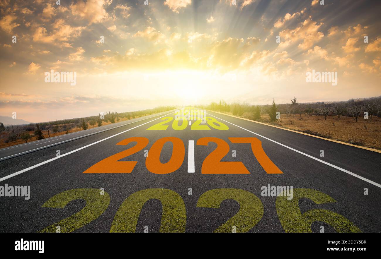 New Year's Day 2027. A straight, empty road with consecutive years ...