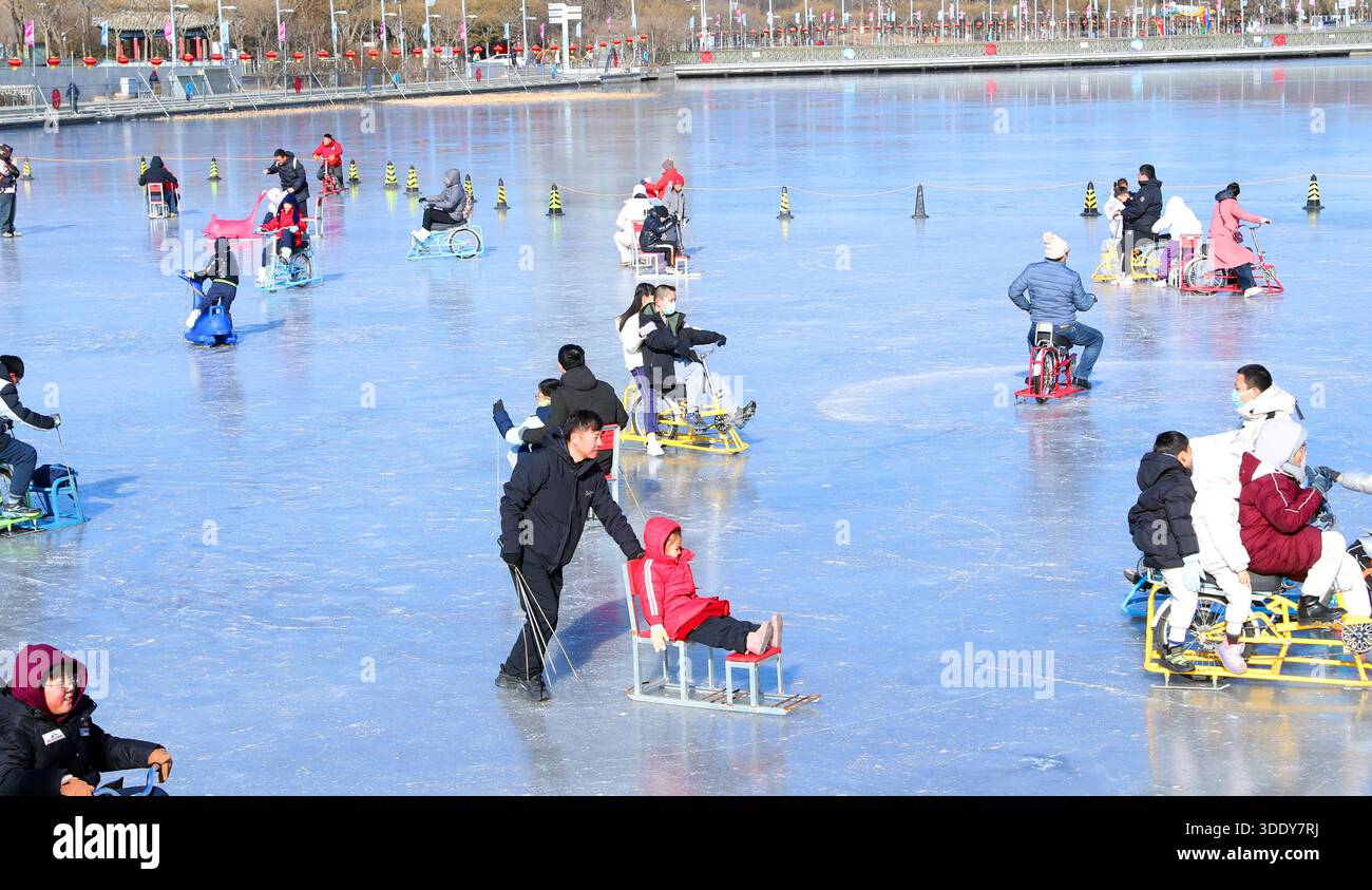 Children skate with their parents at the ice rink in Olympic Park in ...