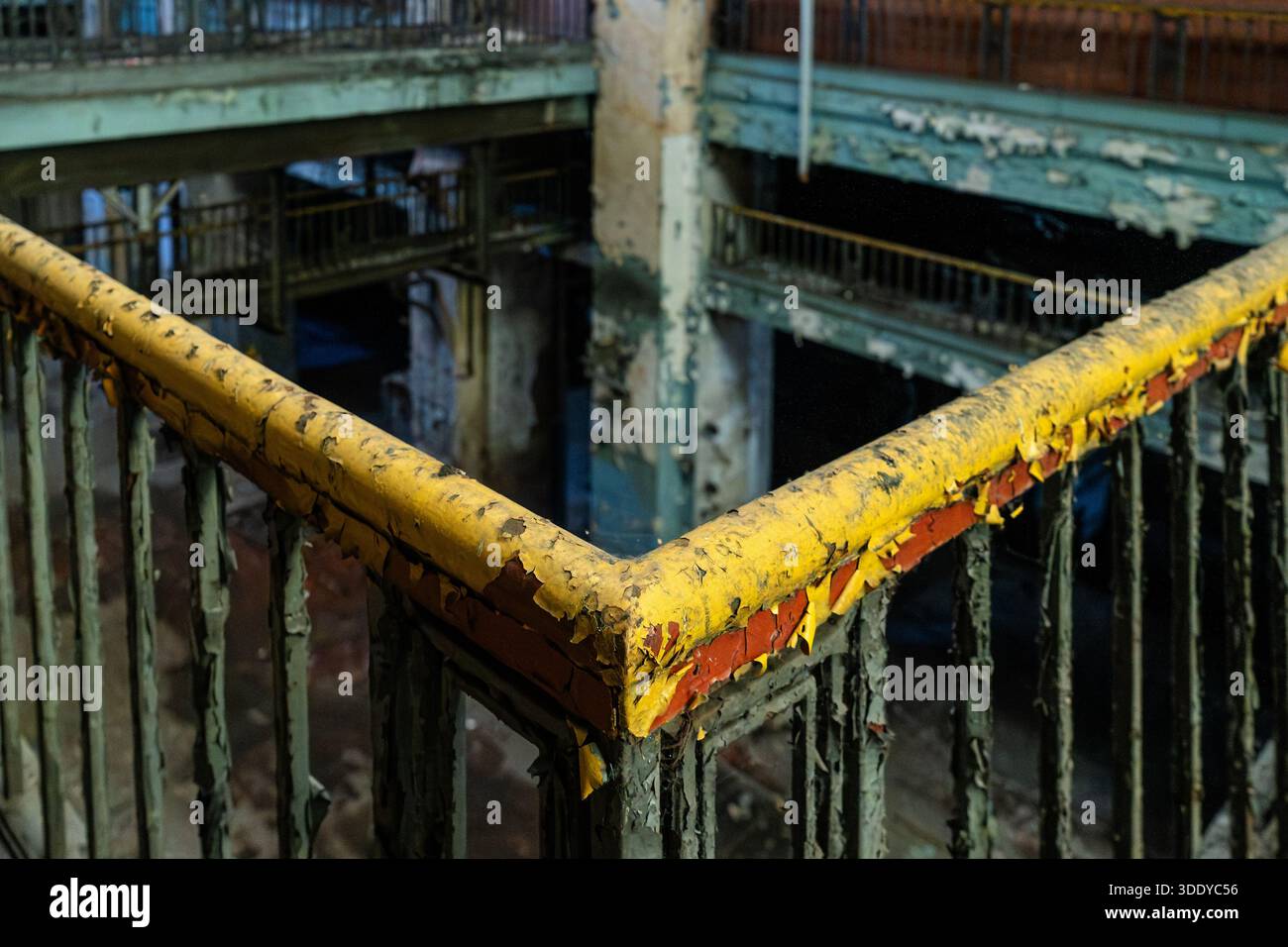 Interior view of an abandoned industrial structure featuring multi ...