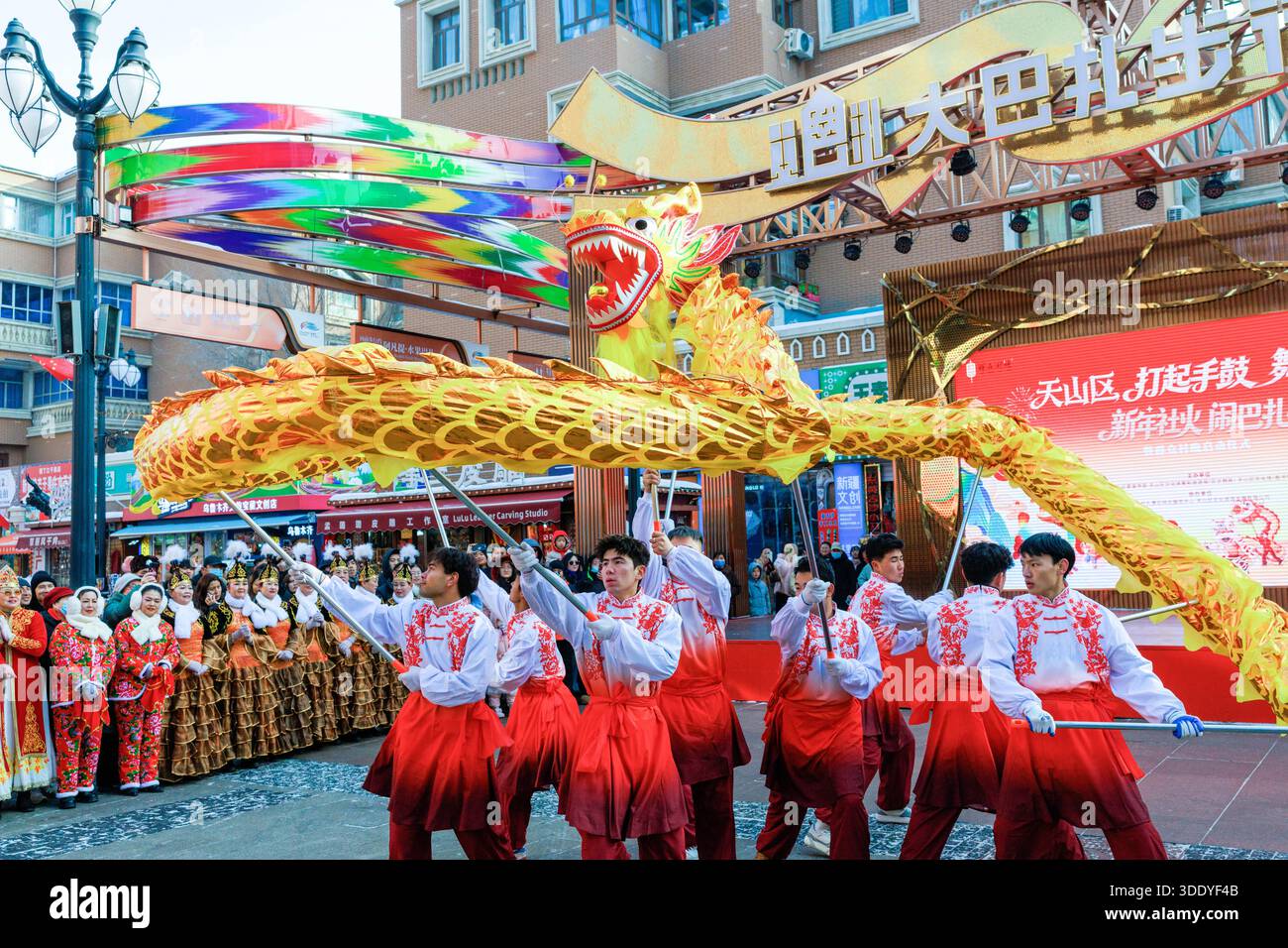 A shehuo team performs for tourists at the Grand Bazaar pedestrian ...