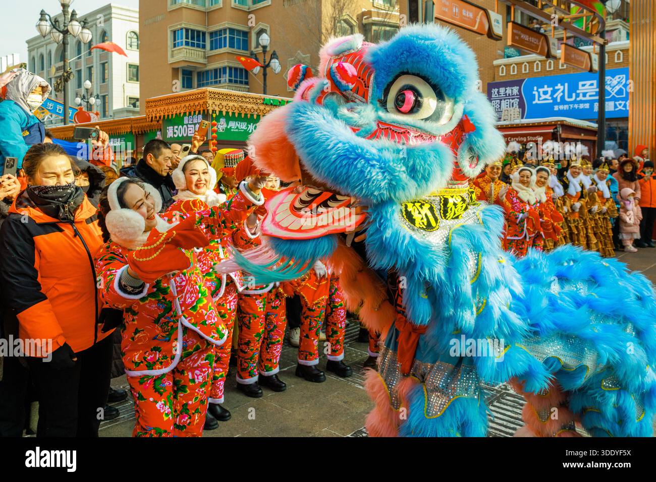A shehuo team performs for tourists at the Grand Bazaar pedestrian ...