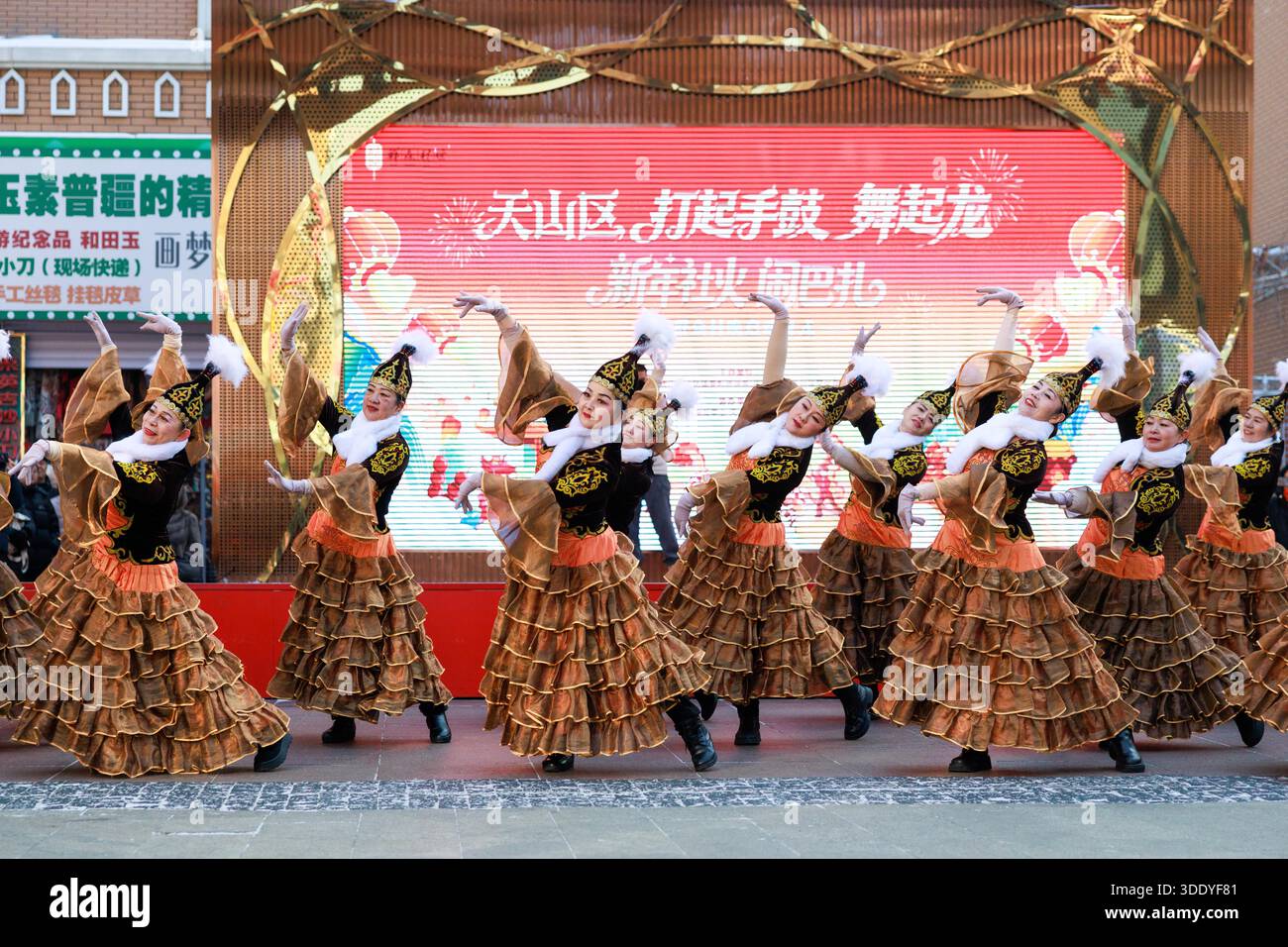 A shehuo team performs for tourists at the Grand Bazaar pedestrian ...