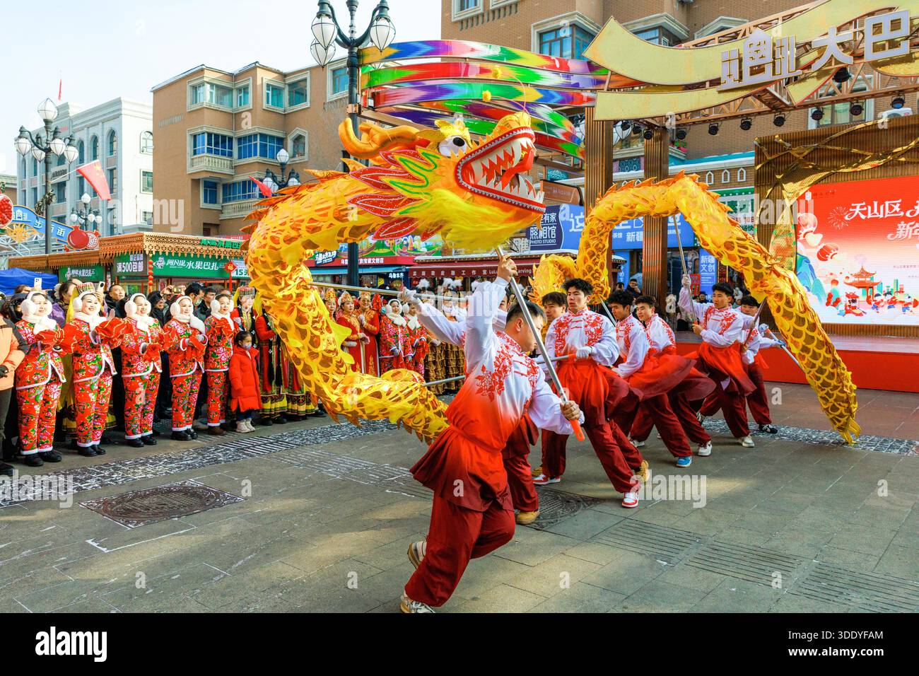 A shehuo team performs for tourists at the Grand Bazaar pedestrian ...