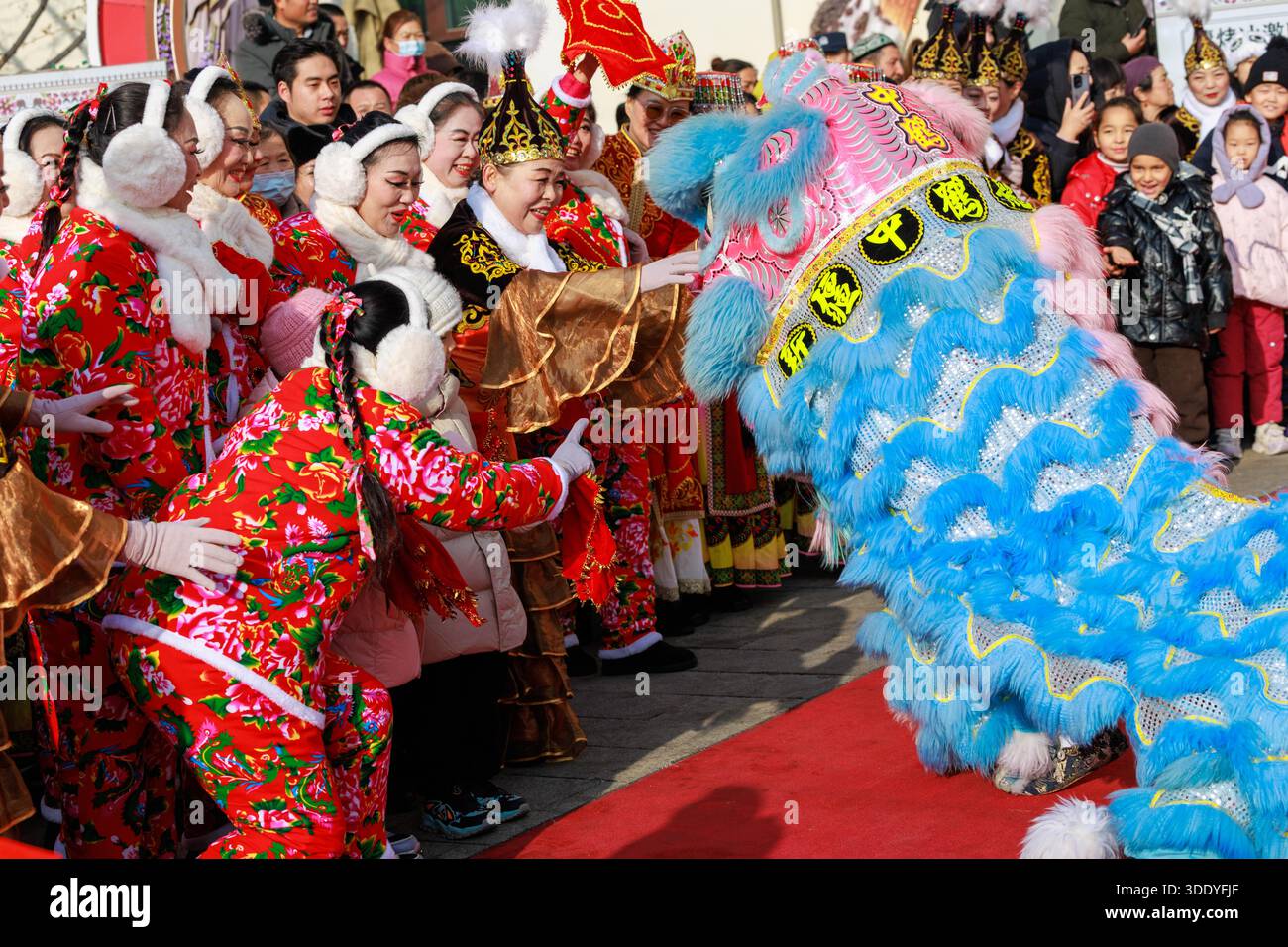 A shehuo team performs for tourists at the Grand Bazaar pedestrian ...