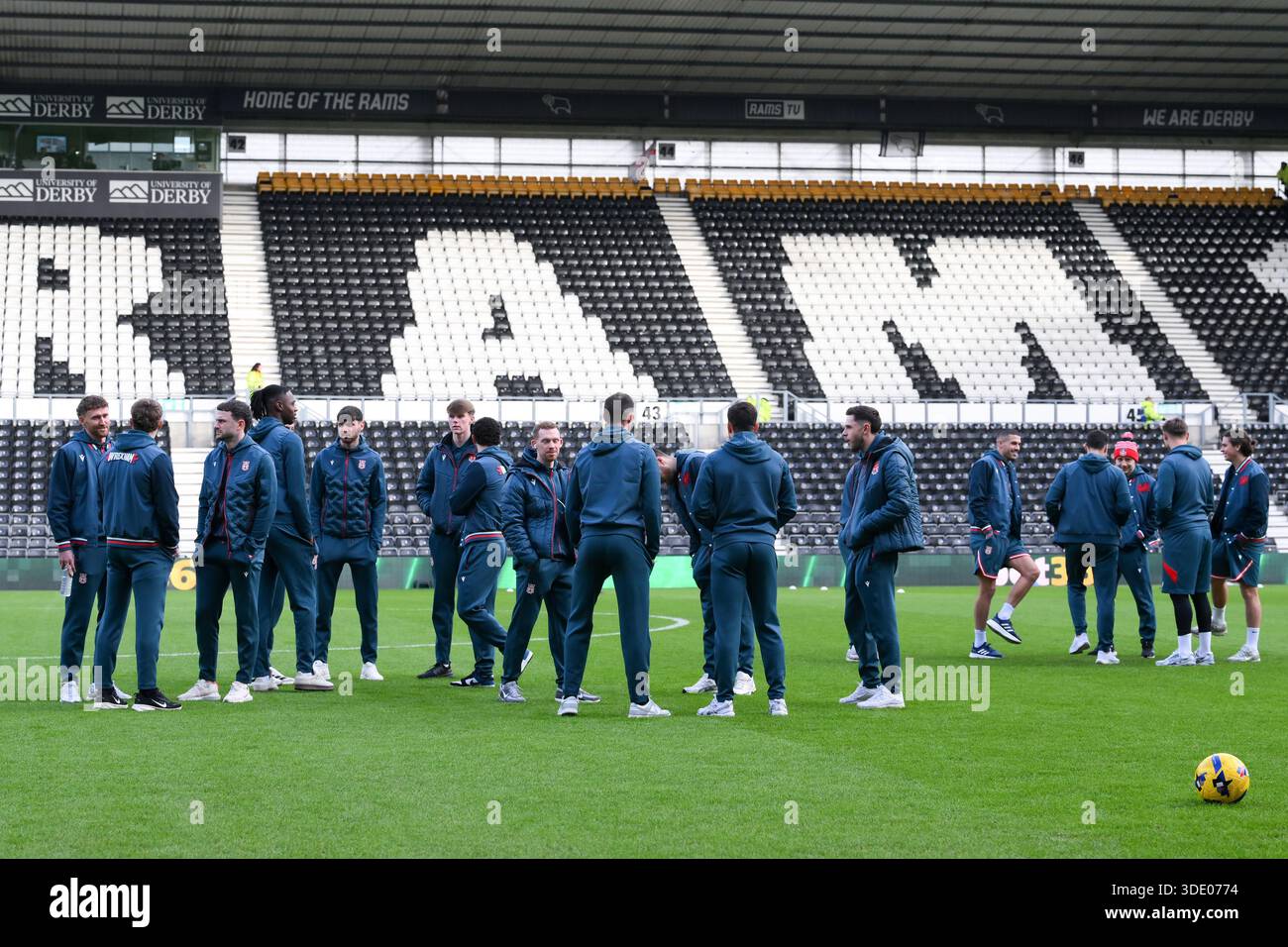 Wrexham players inspect the pitch ahead of the Sky Bet Championship ...