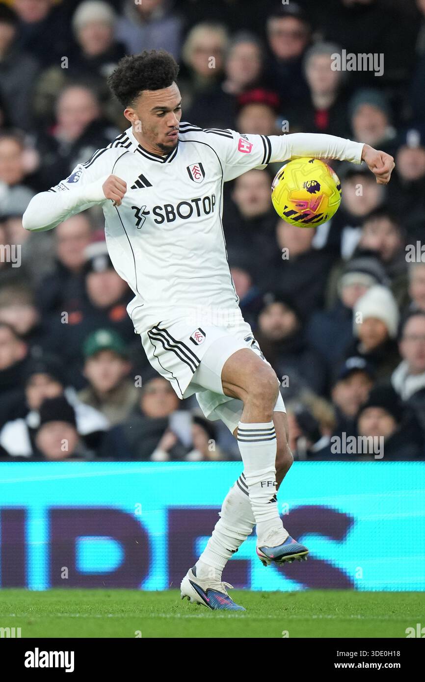 Fulham's Antonee Robinson commits a handball during the English Premier ...