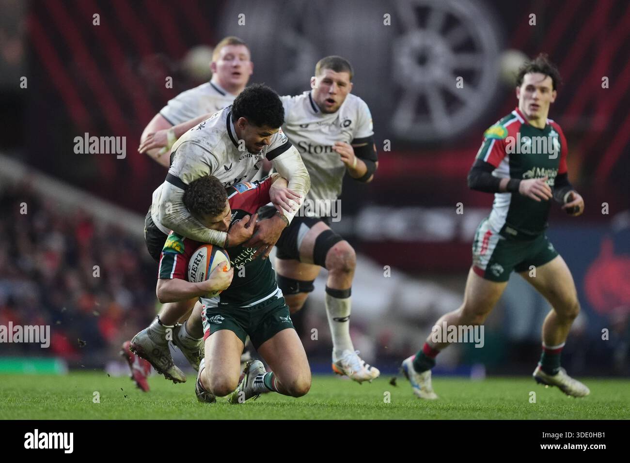 Leicester Tigers' Billy Searle tackled by Saracens' Theo McFarland ...