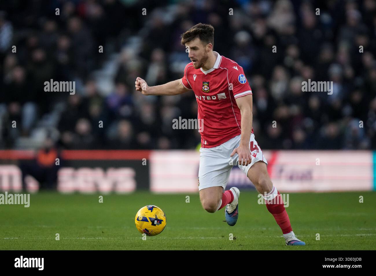 George Thomason of Wrexham makes a run with the ball during the Sky Bet ...