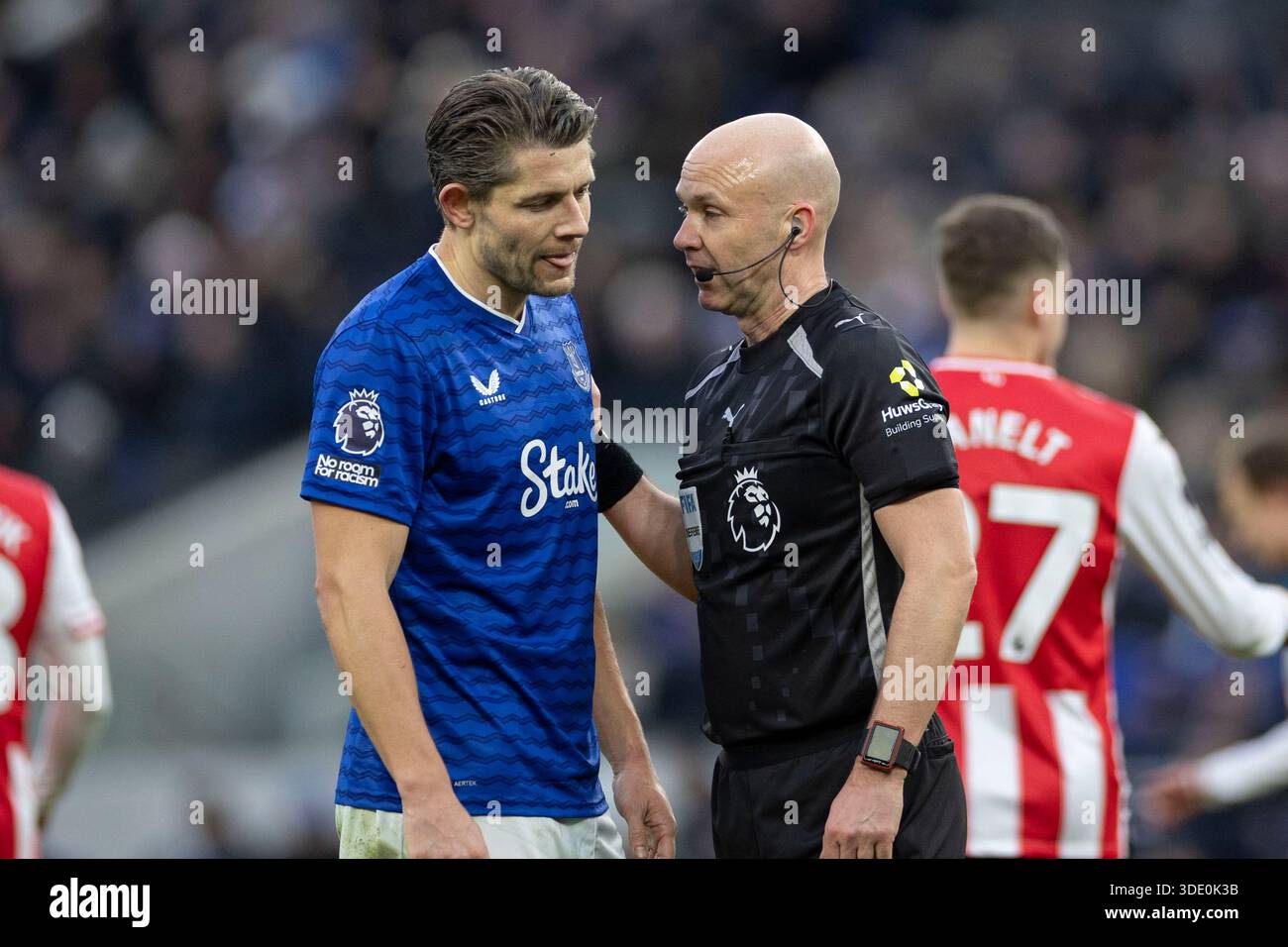 Referee, Anthony Taylor in discussion with James Tarkowski #6 of ...