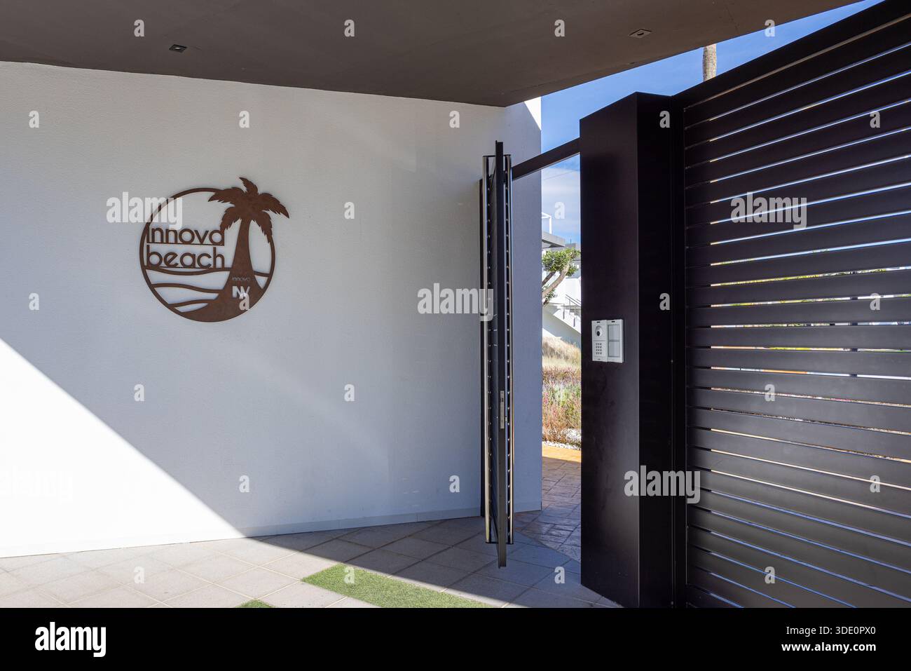 Stylish entrance with Innova Beach logo and secure gate at Punta Prima ...