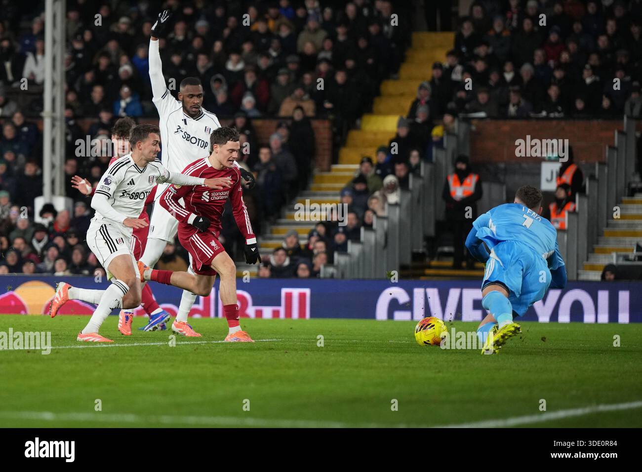 Fulham's goalkeeper Bernd Leno saves a shot by Liverpool's Florian ...