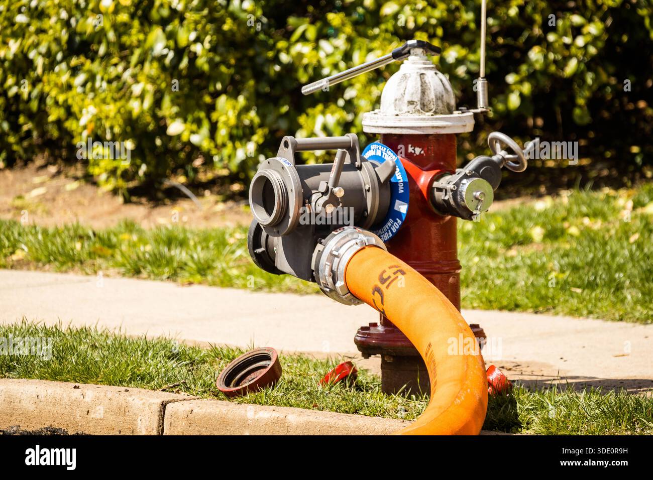 Fire hydrant in use during a structure fire hi-res stock photography ...
