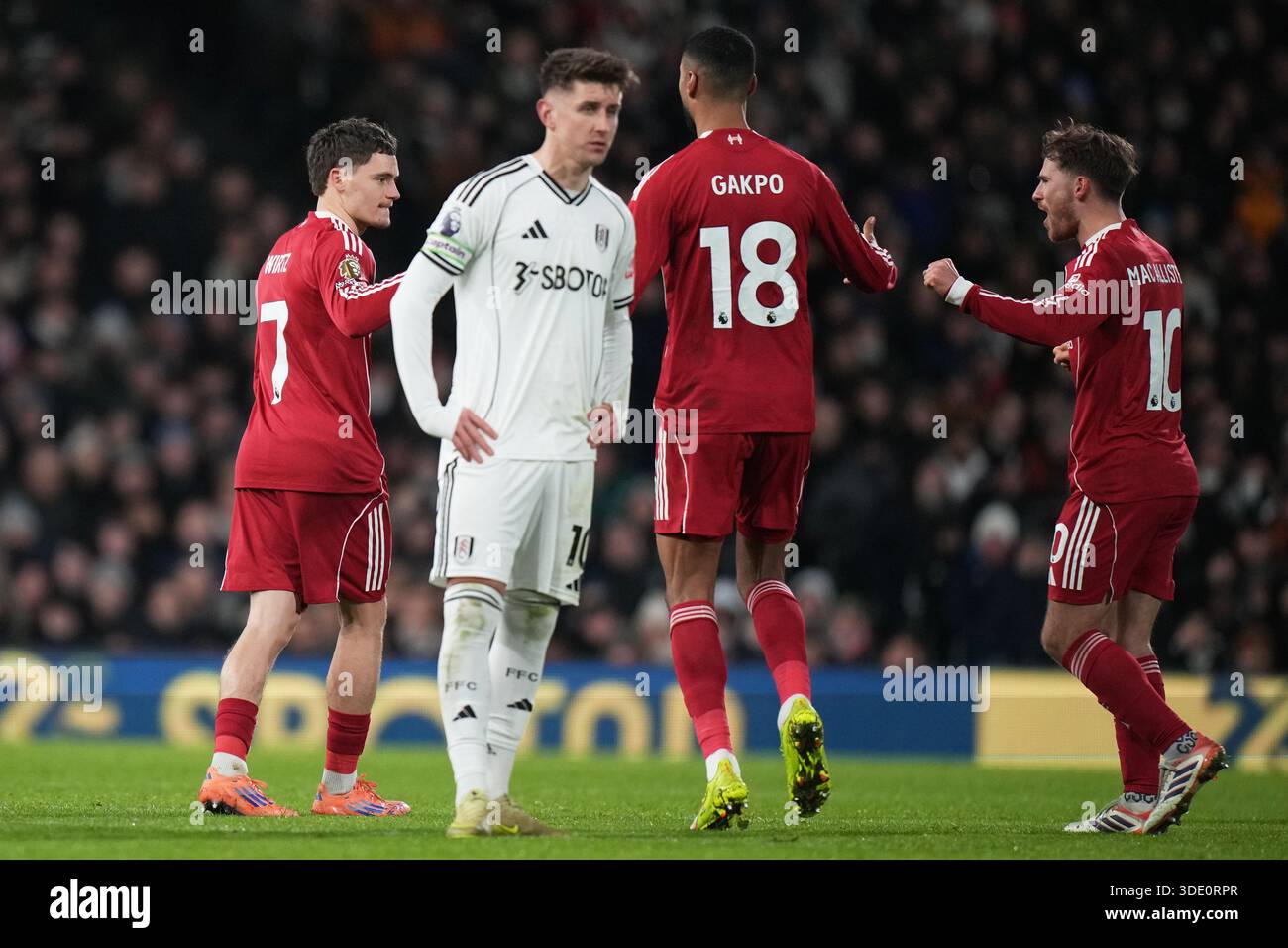 Liverpool's Florian Wirtz, left, celebrates after scoring his side's ...