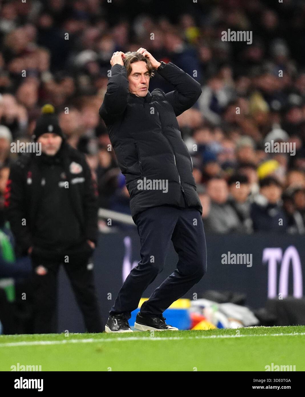 Tottenham Hotspur manager Thomas Frank reacts on the touchline during ...