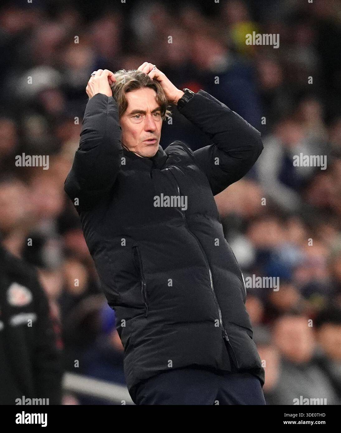 Tottenham Hotspur manager Thomas Frank reacts on the touchline during ...