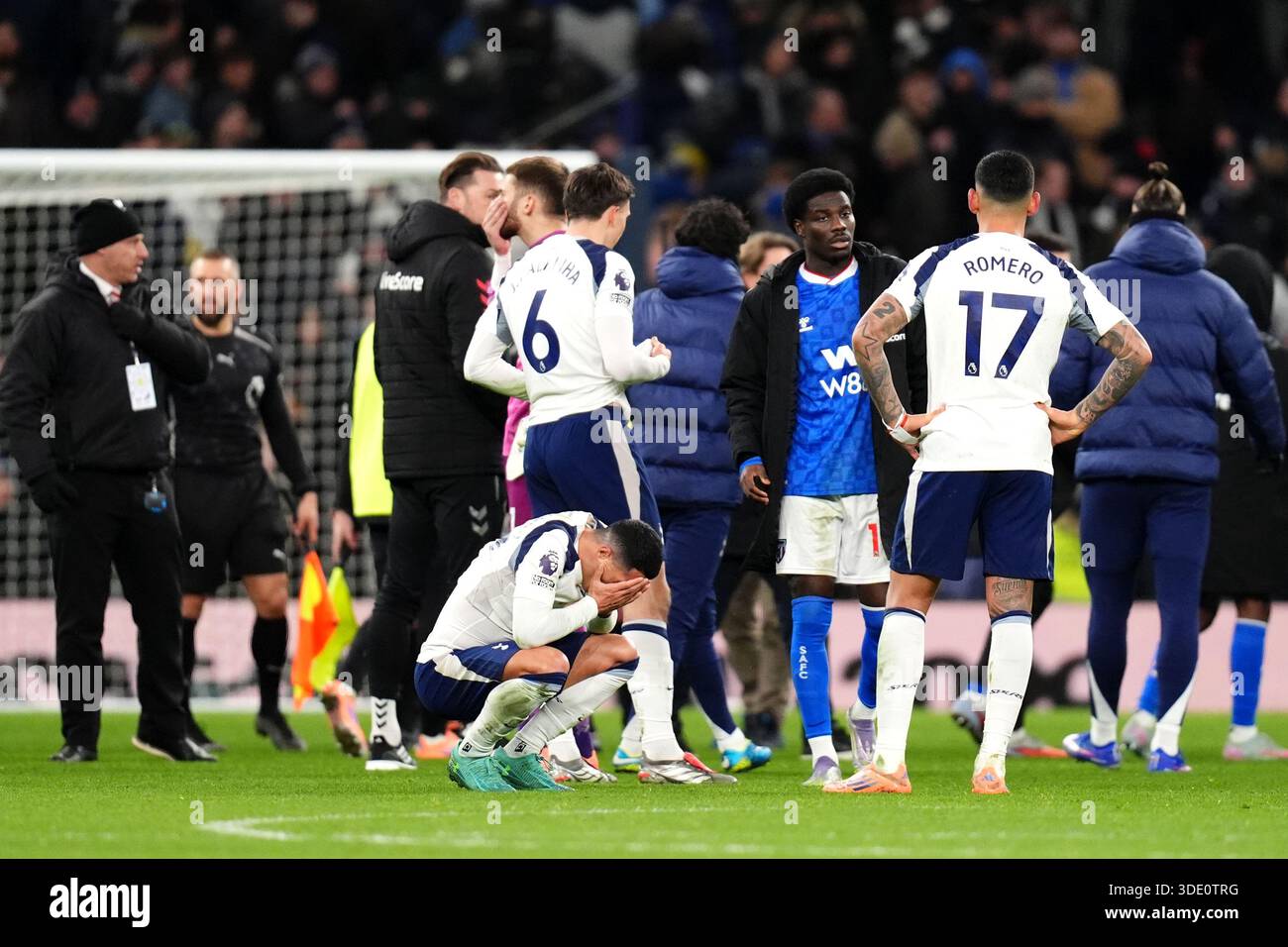 Tottenham Hotspur's Pedro Porro (crouching) reacts following the ...
