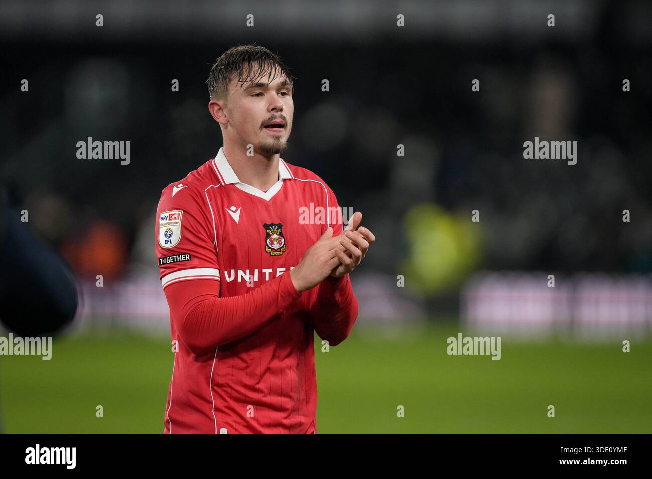 Callum Doyle of Wrexham applauds the fans after the final whistle ...
