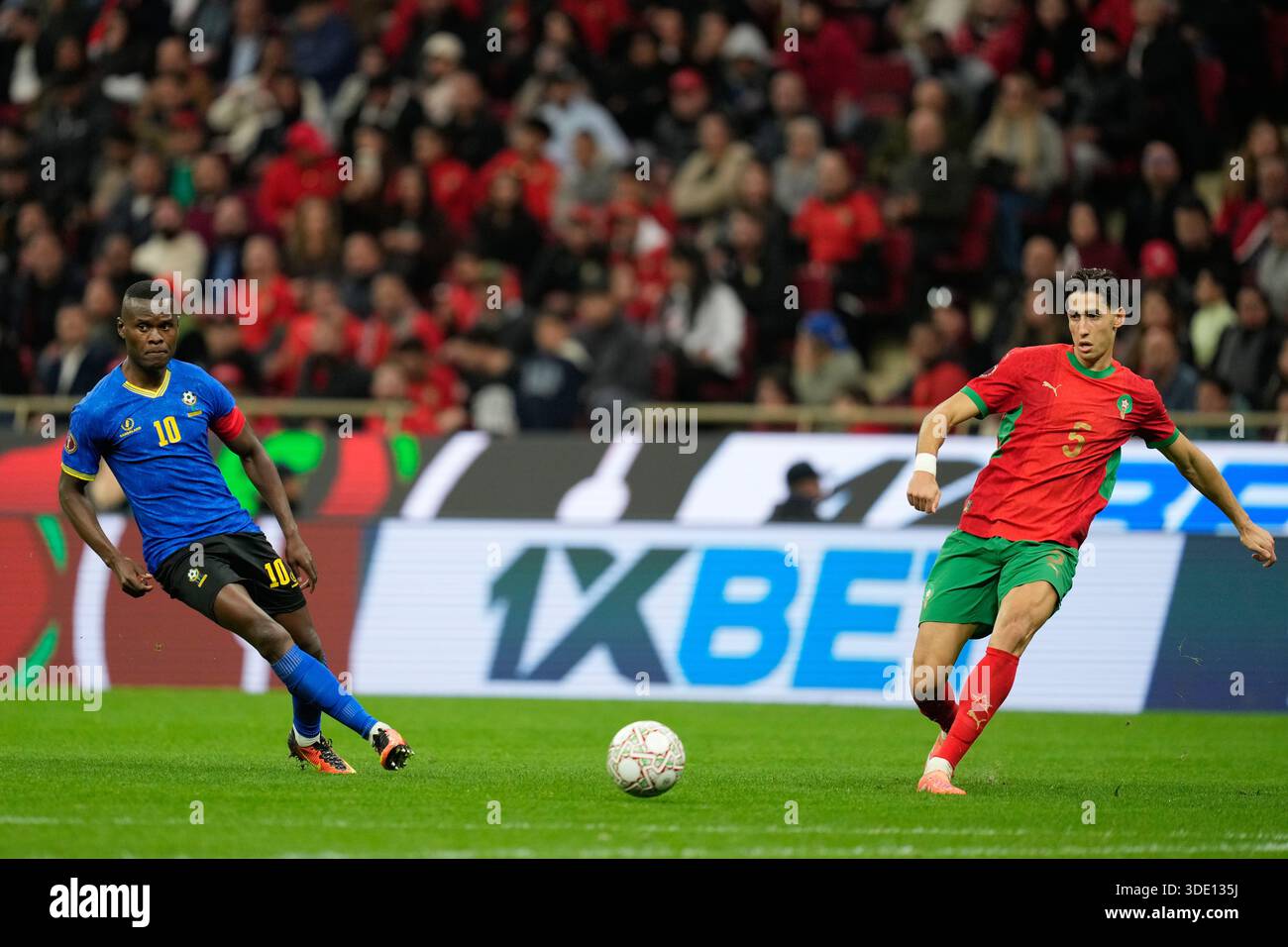 Tanzania's Mbwana Samatta, left, and Morocco's Nayef Aguerd vie for the ...