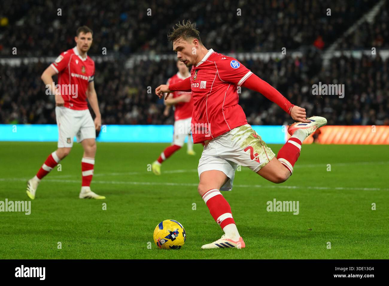 Callum Doyle of Wrexham lines up a cross during the Sky Bet ...