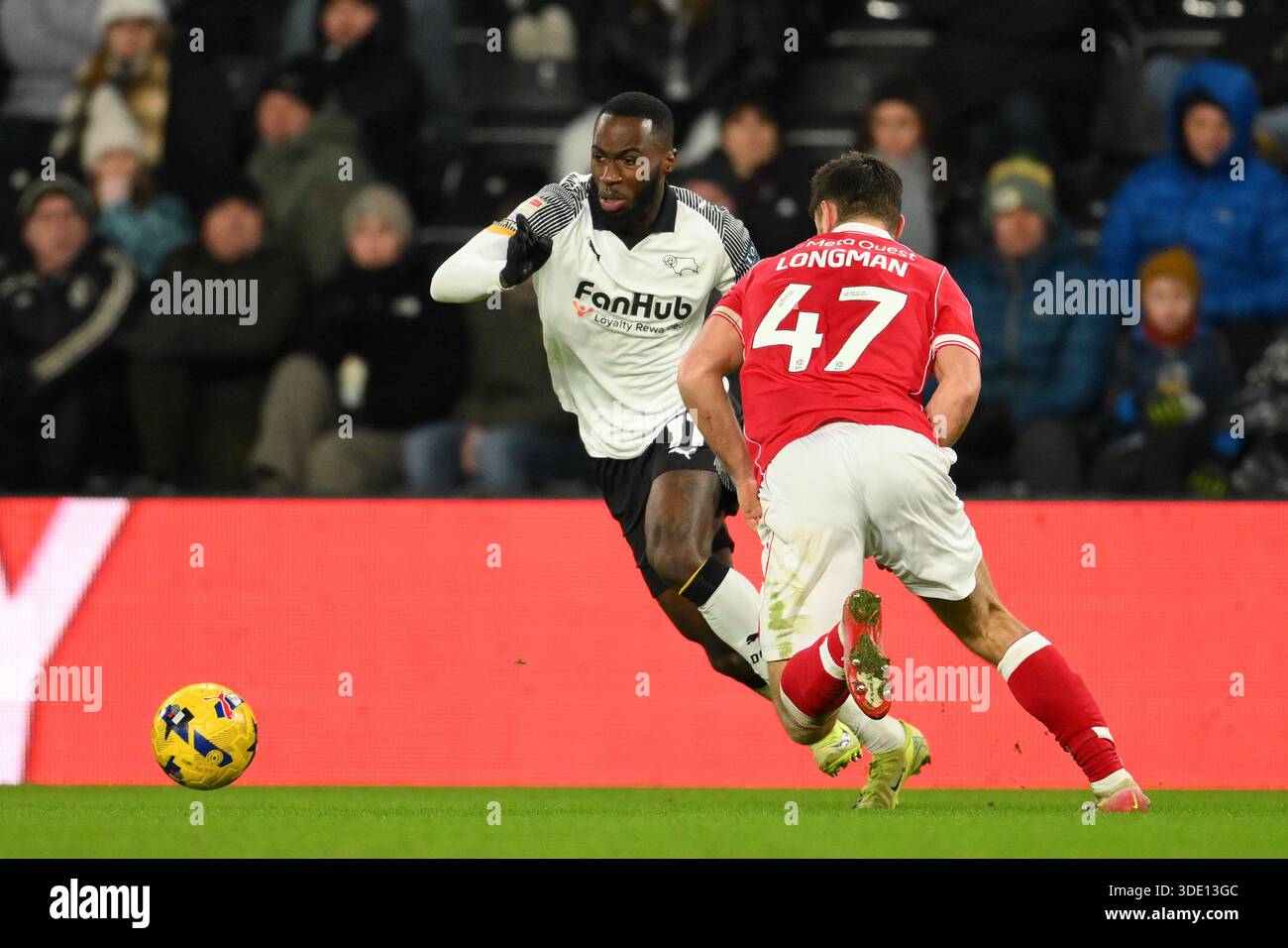 Corey Blackett-Taylor of Derby County under pressure from Ryan Longman ...