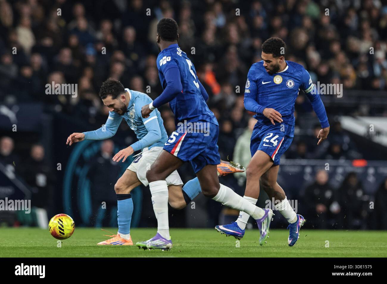 Rayan Cherki of Manchester City is fouled by Reece James of Chelsea ...