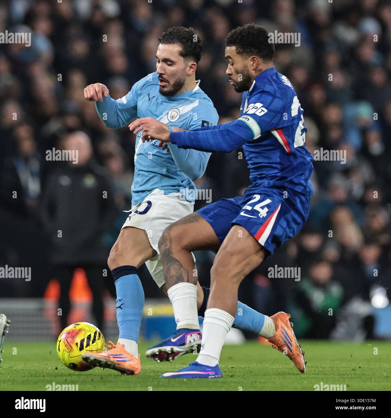 Rayan Cherki of Manchester City is fouled by Reece James of Chelsea ...