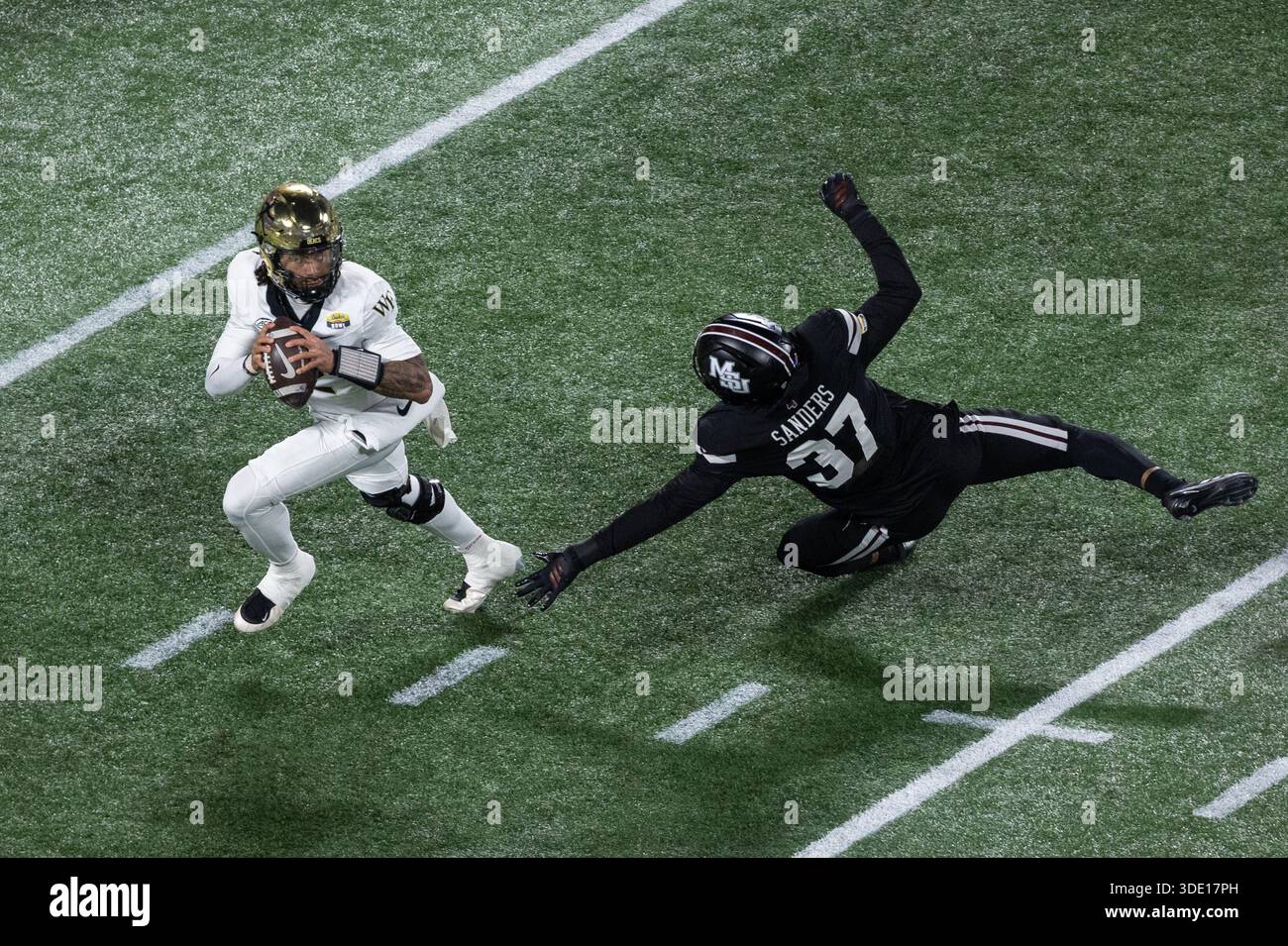Wake Forest quarterback Robby Ashford (2) rolls away from Mississippi ...