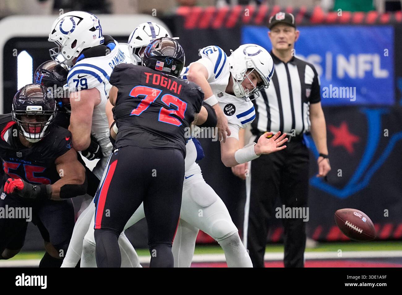 Indianapolis Colts quarterback Riley Leonard, right, fumble in front of ...