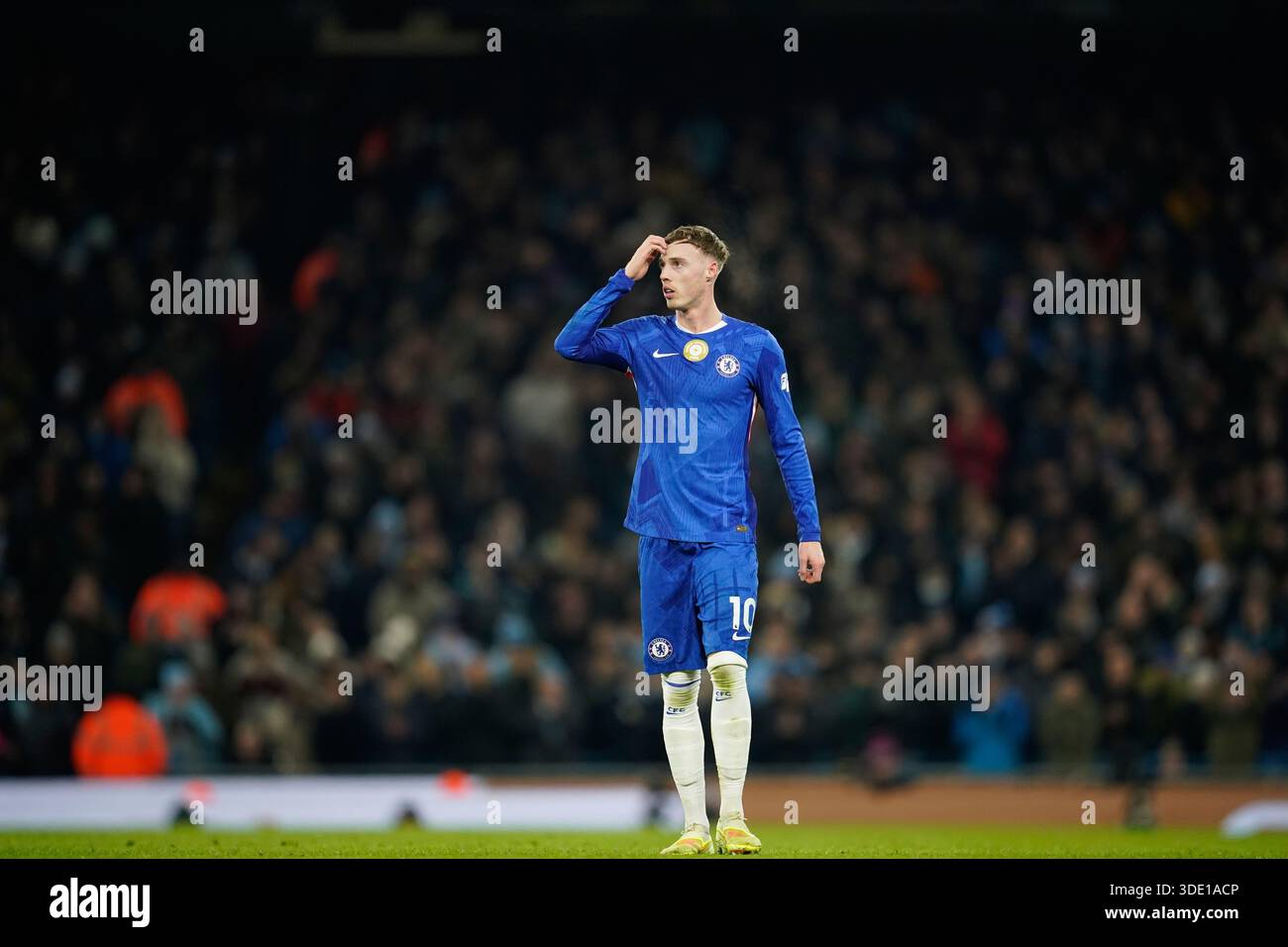 Chelsea's Cole Palmer stands on the pitch during the English Premier ...