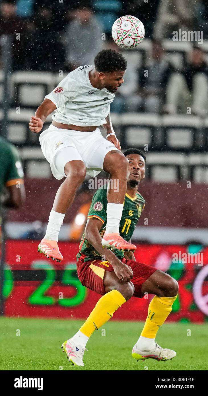 South Africa's Lyle Foster and Cameroon's Samuel Kotto challenge for ...