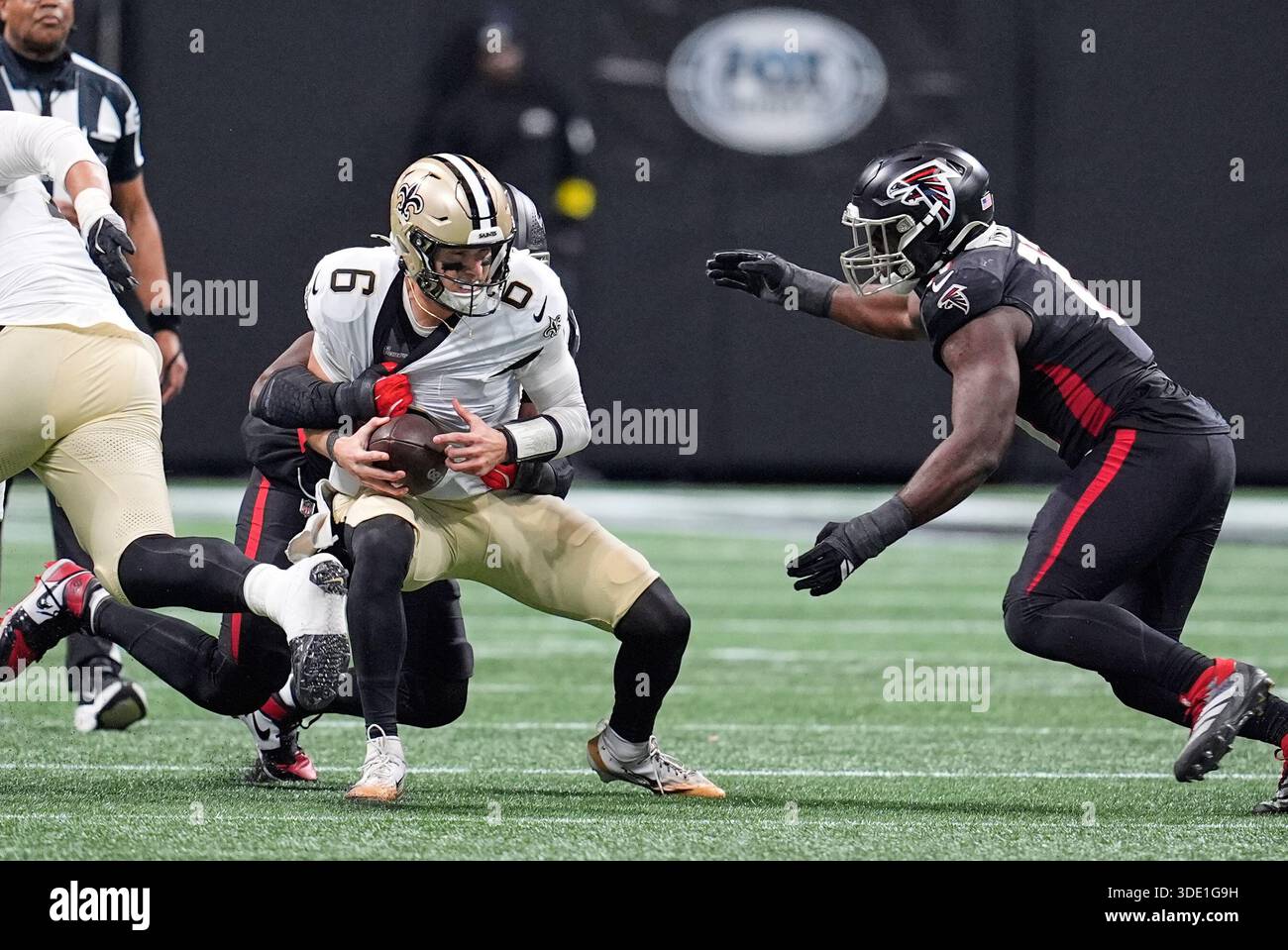 New Orleans Saints quarterback Tyler Shough (6) is sacked by Atlanta ...