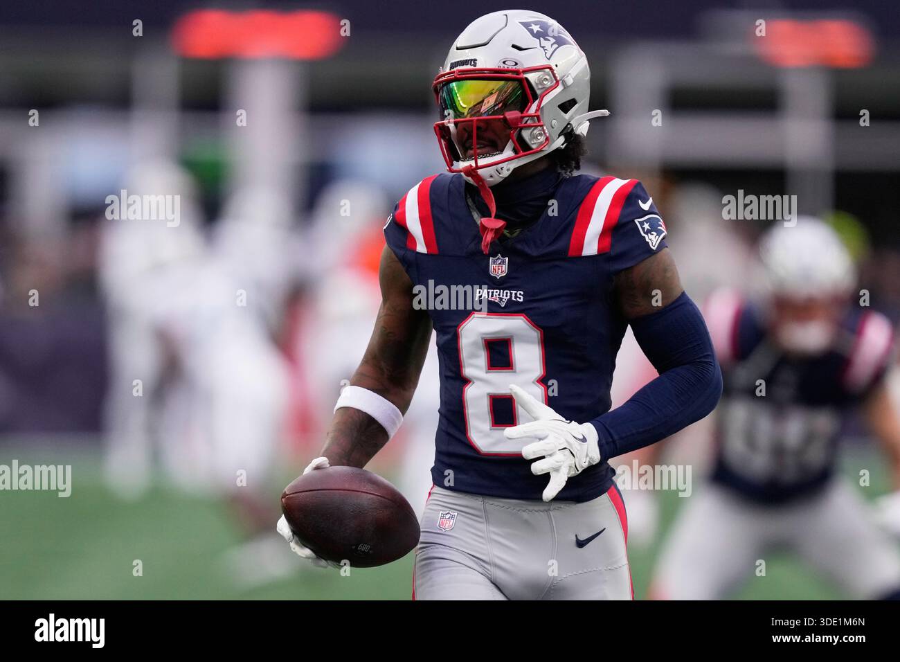 New England Patriots wide receiver Stefon Diggs warms up before an NFL ...