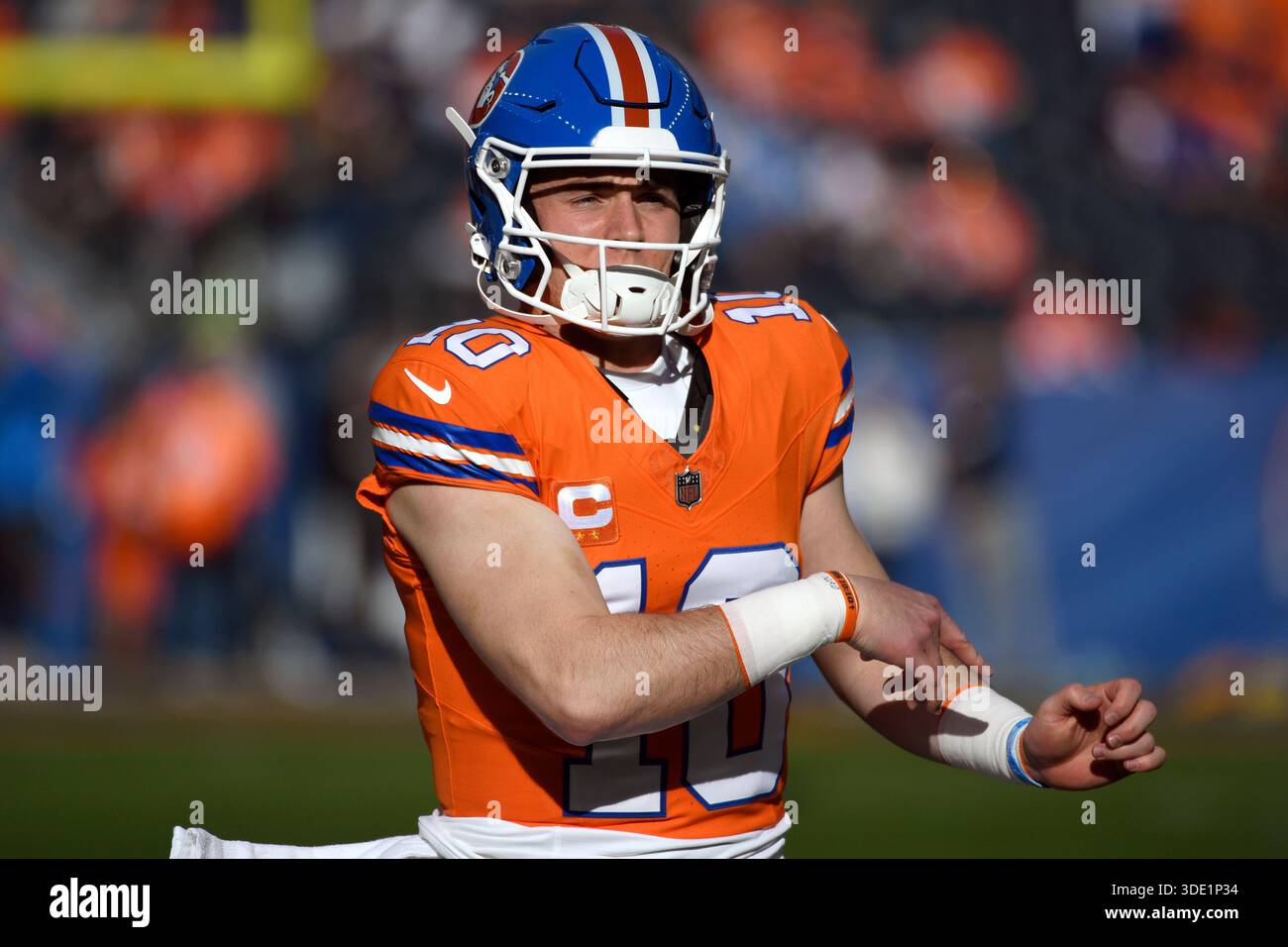 Denver Broncos quarterback Bo Nix warms up before an NFL football game ...